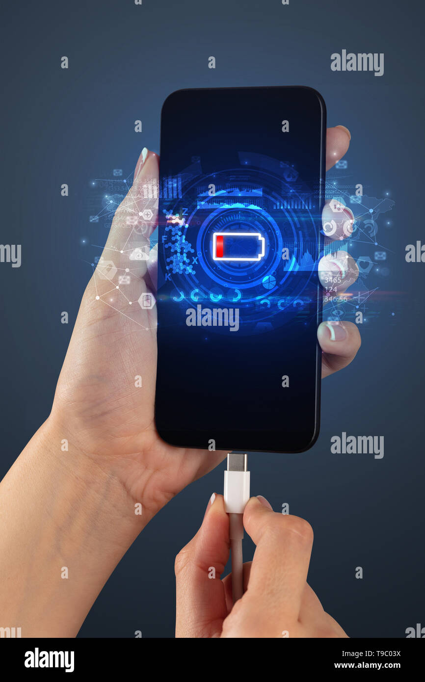 Elegant hand charging smartphone with global report concept Stock Photo ...