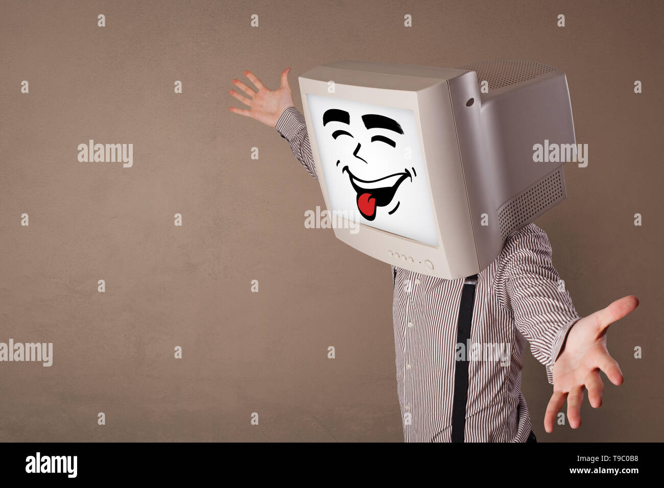 Young person with happy smiley monitor head Stock Photo - Alamy