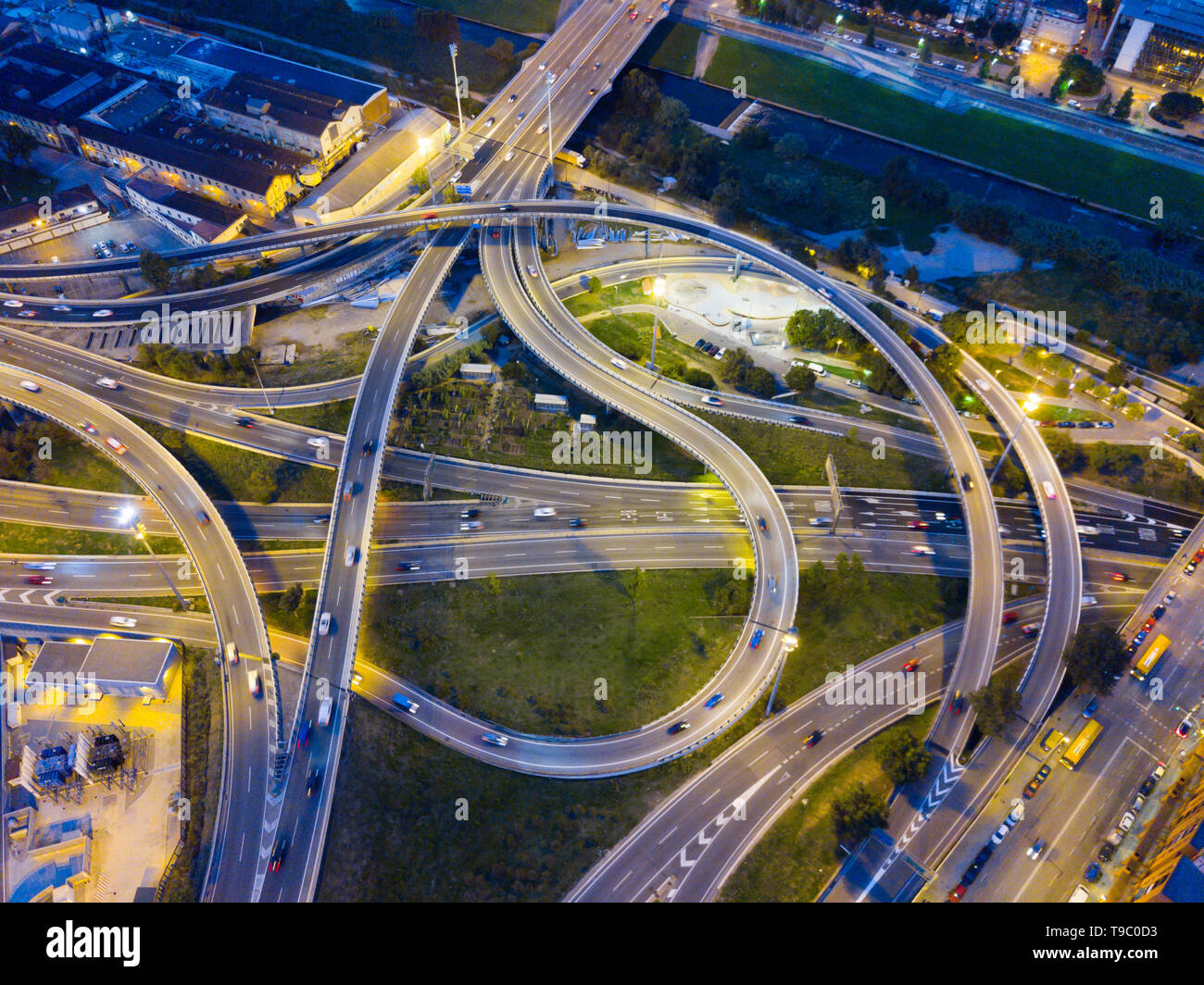 Aerial view of modern city highway grade separation in night lights ...