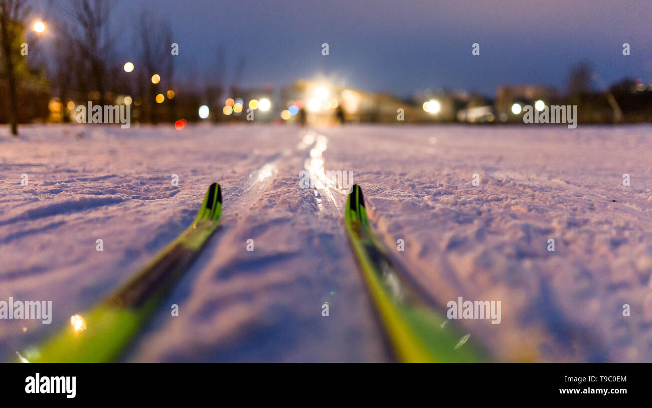 Photo of skis on background of burning lights Stock Photo - Alamy
