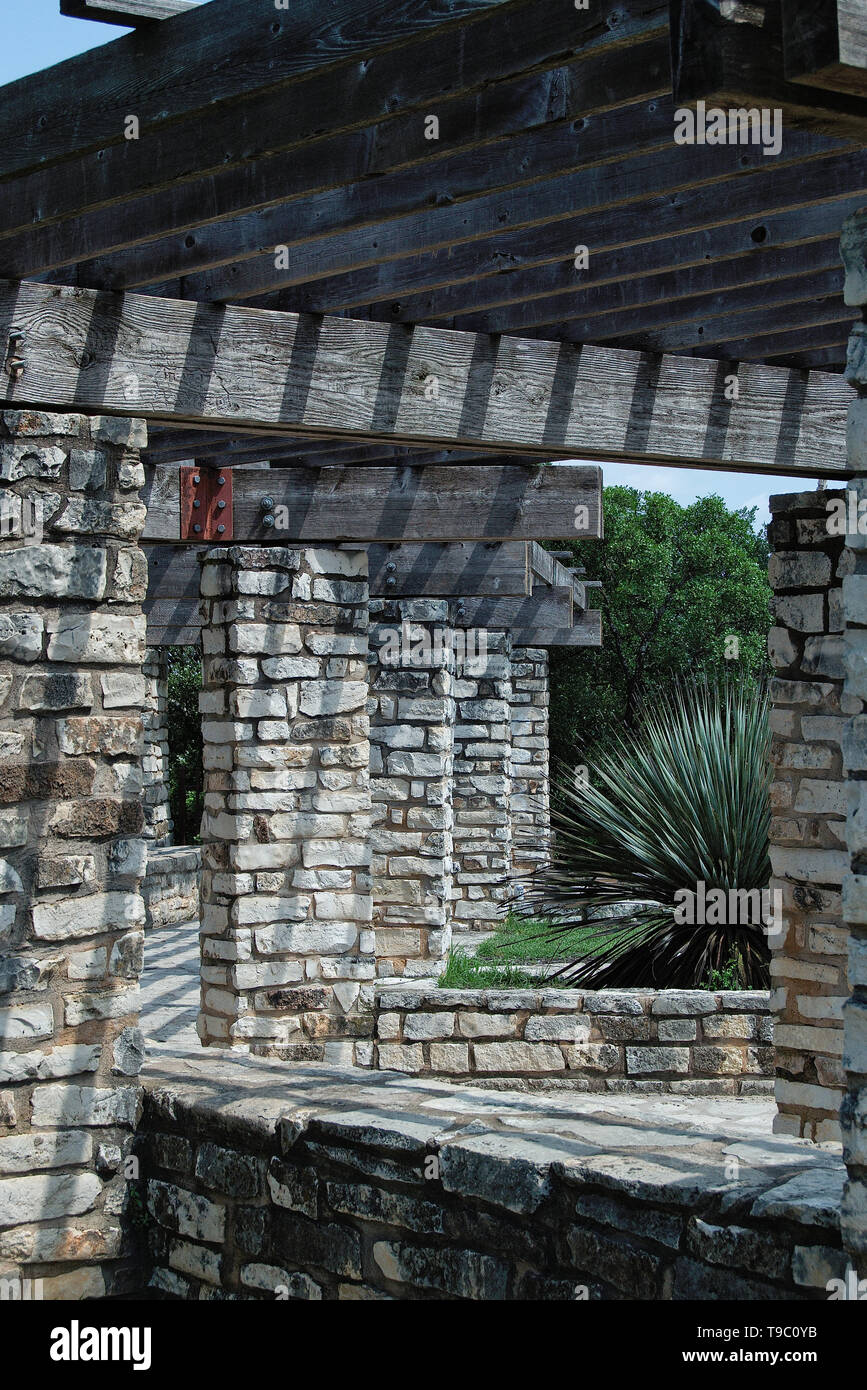 Rock pagoda with rustic wooden rafter roof Stock Photo - Alamy