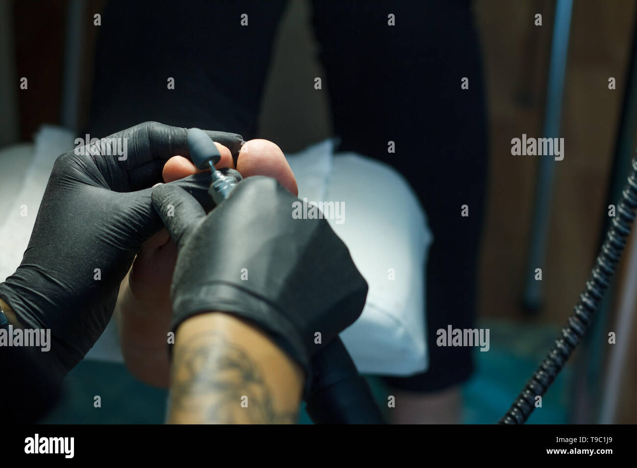 Professional hardware pedicure using electric machine.Patient on ...