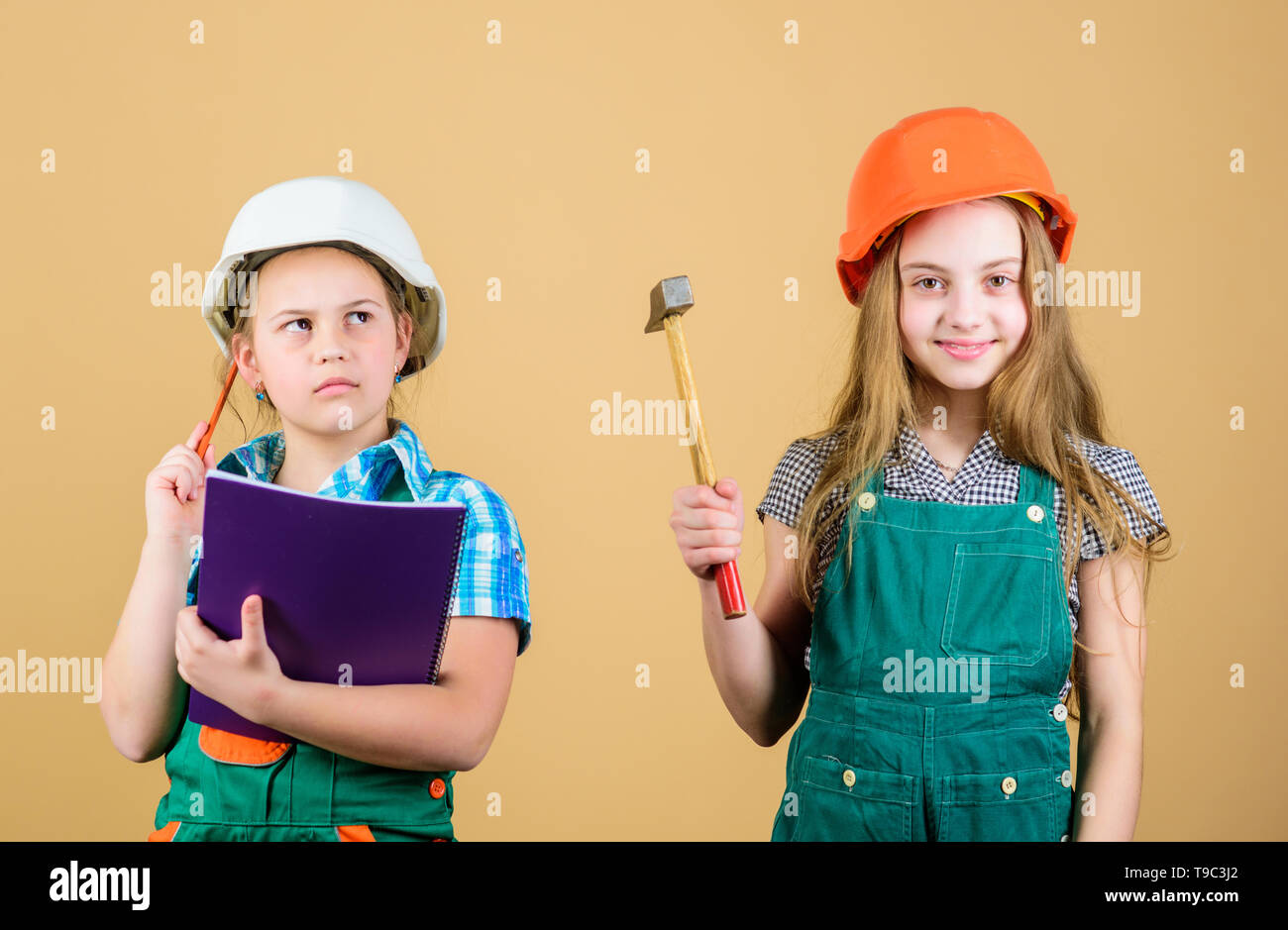 small girls repairing together in workshop. Foreman inspector. Repair ...