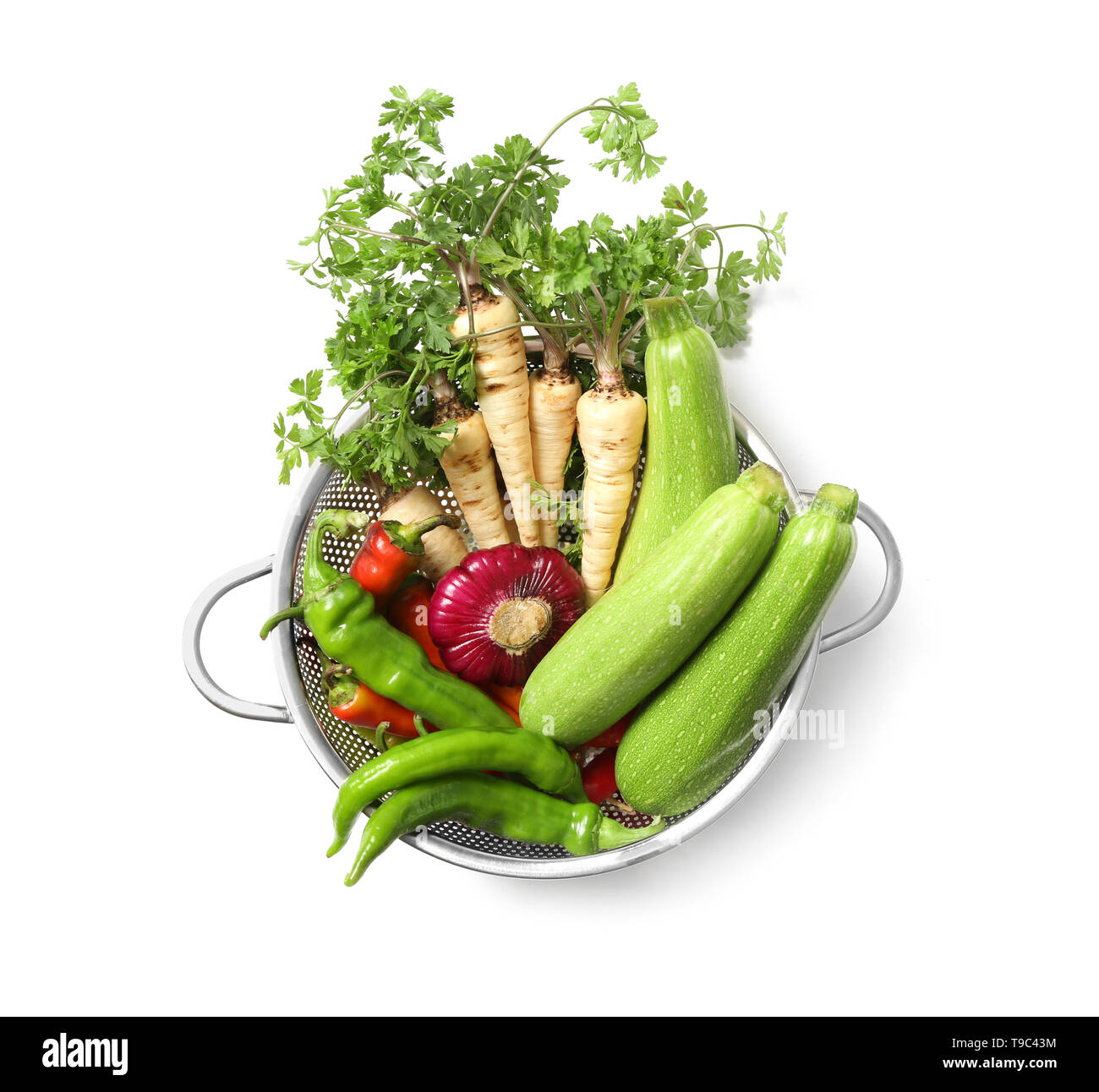 Colander with various fresh vegetables on white background Stock Photo ...