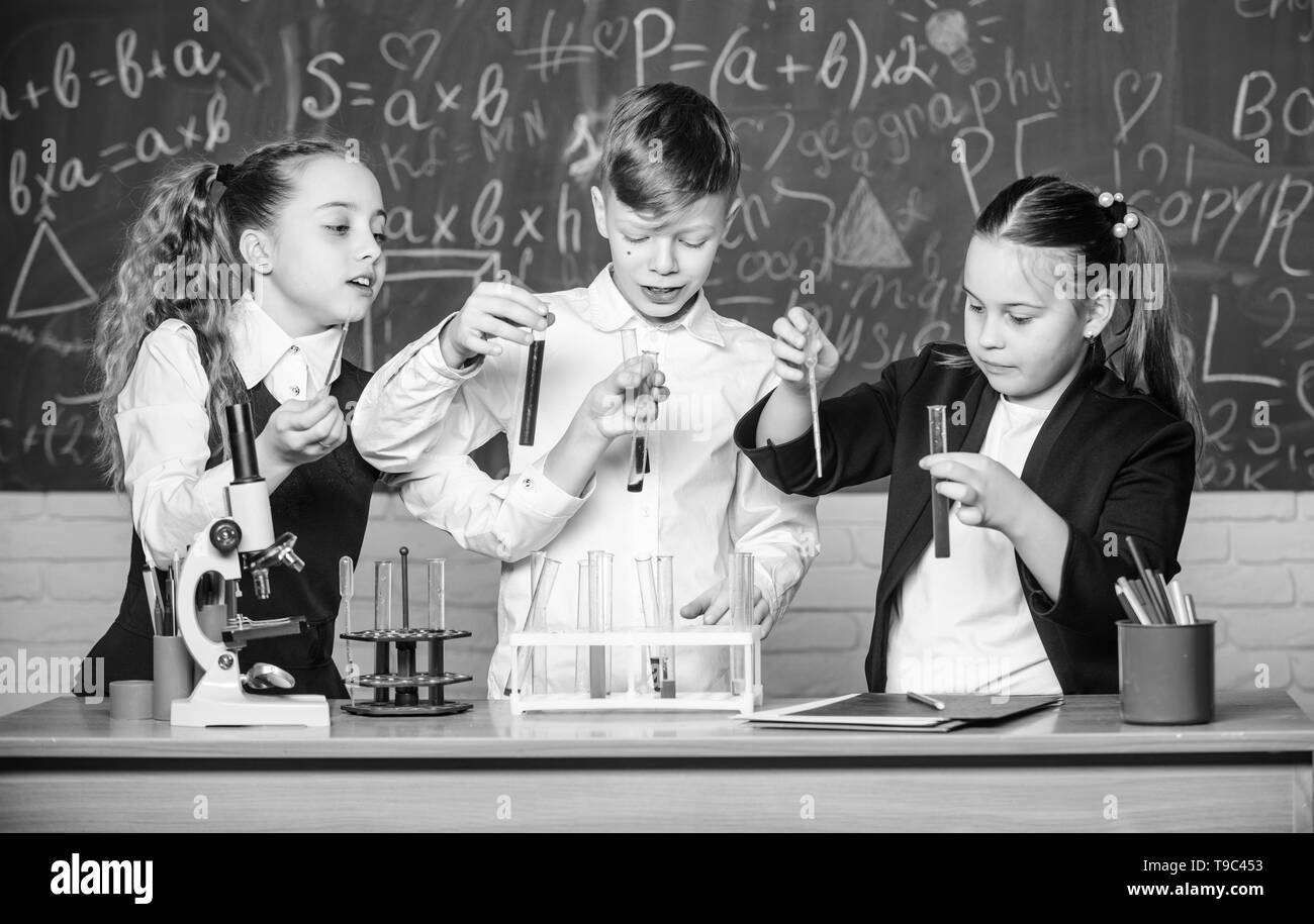 Chemistry microscope. Little kids learning chemistry in school lab ...