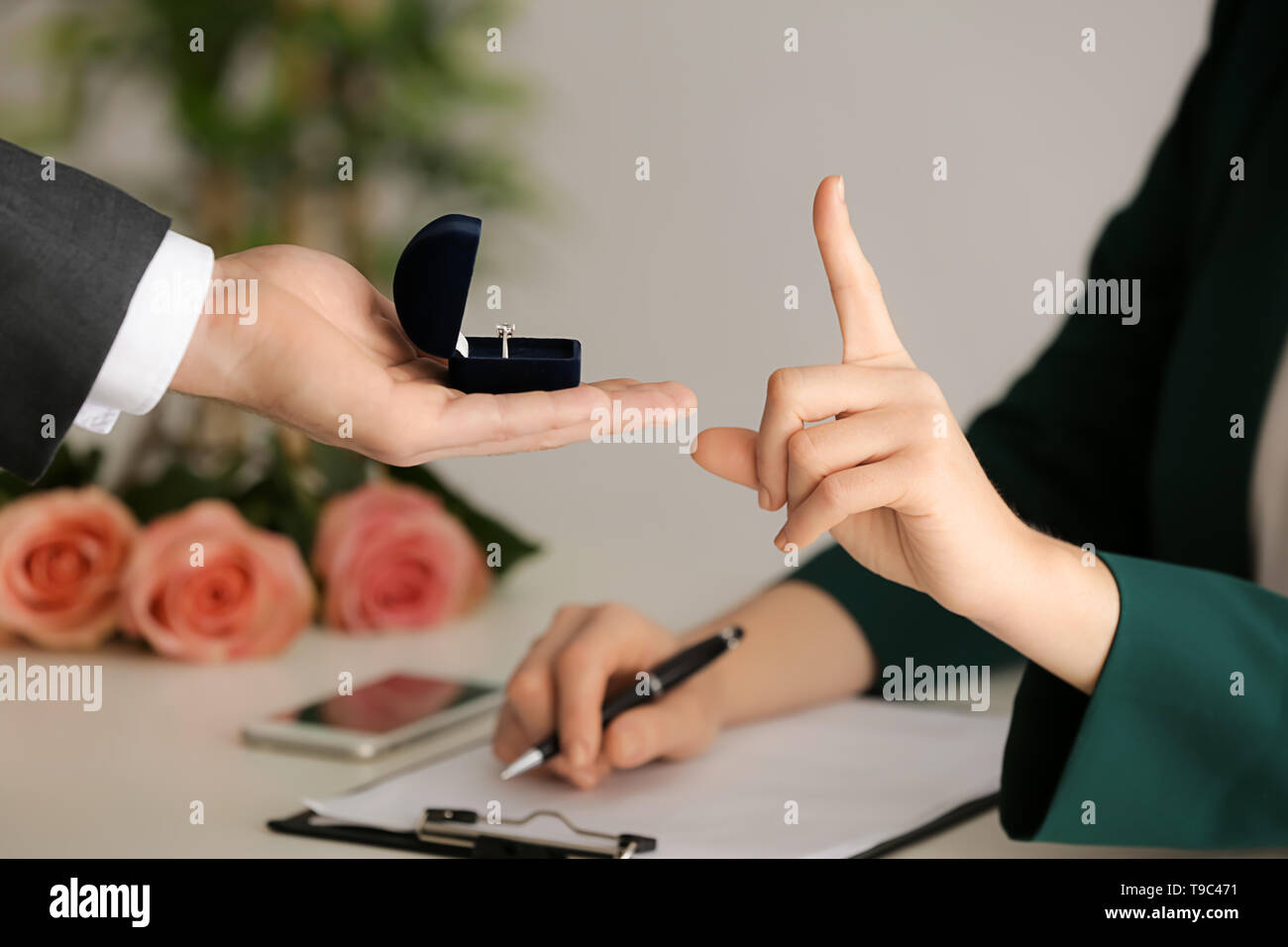 Young woman rejecting marriage proposal Stock Photo - Alamy