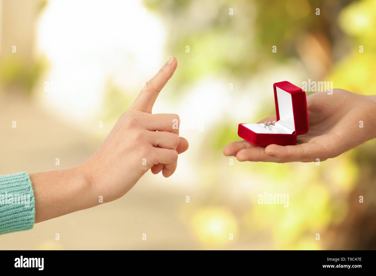 Young woman rejecting marriage proposal Stock Photo - Alamy