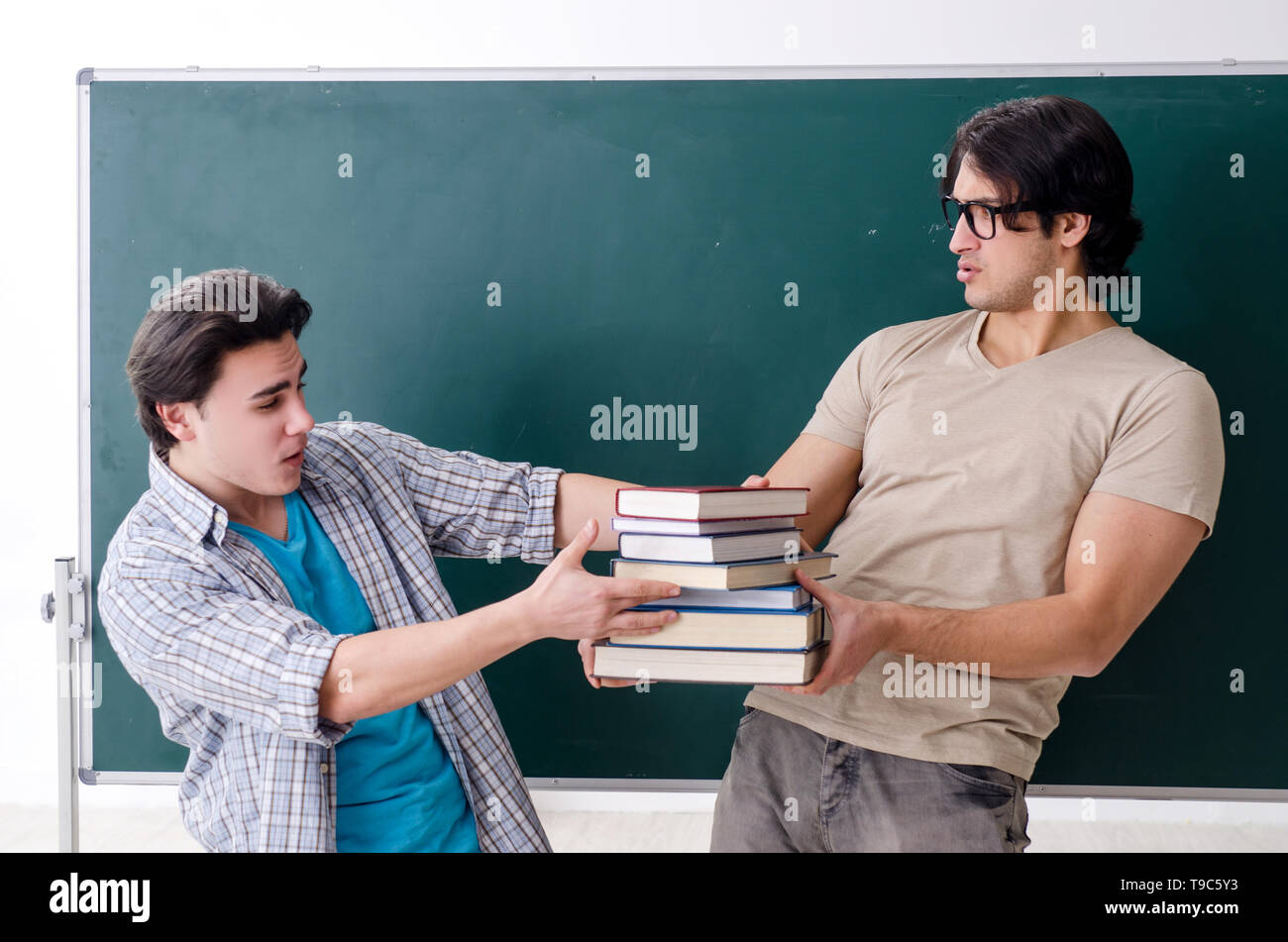 Two male students in the classroom Stock Photo - Alamy