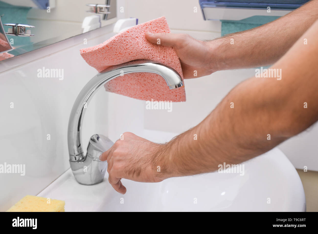 Wiping bathroom sink hi-res stock photography and images - Alamy
