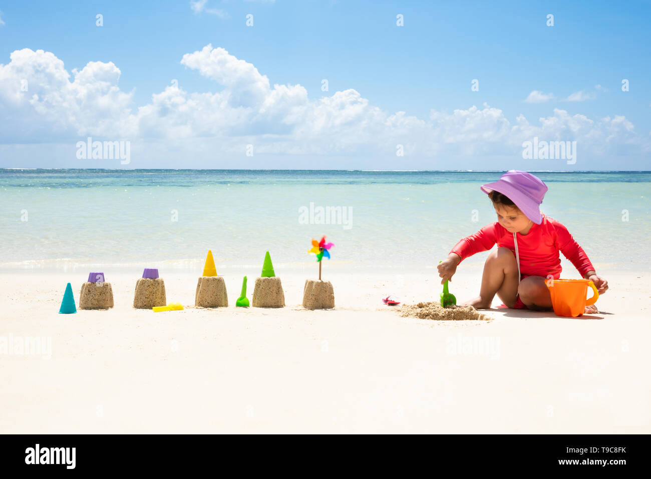 Kid girl blowing windmill hi-res stock photography and images - Alamy