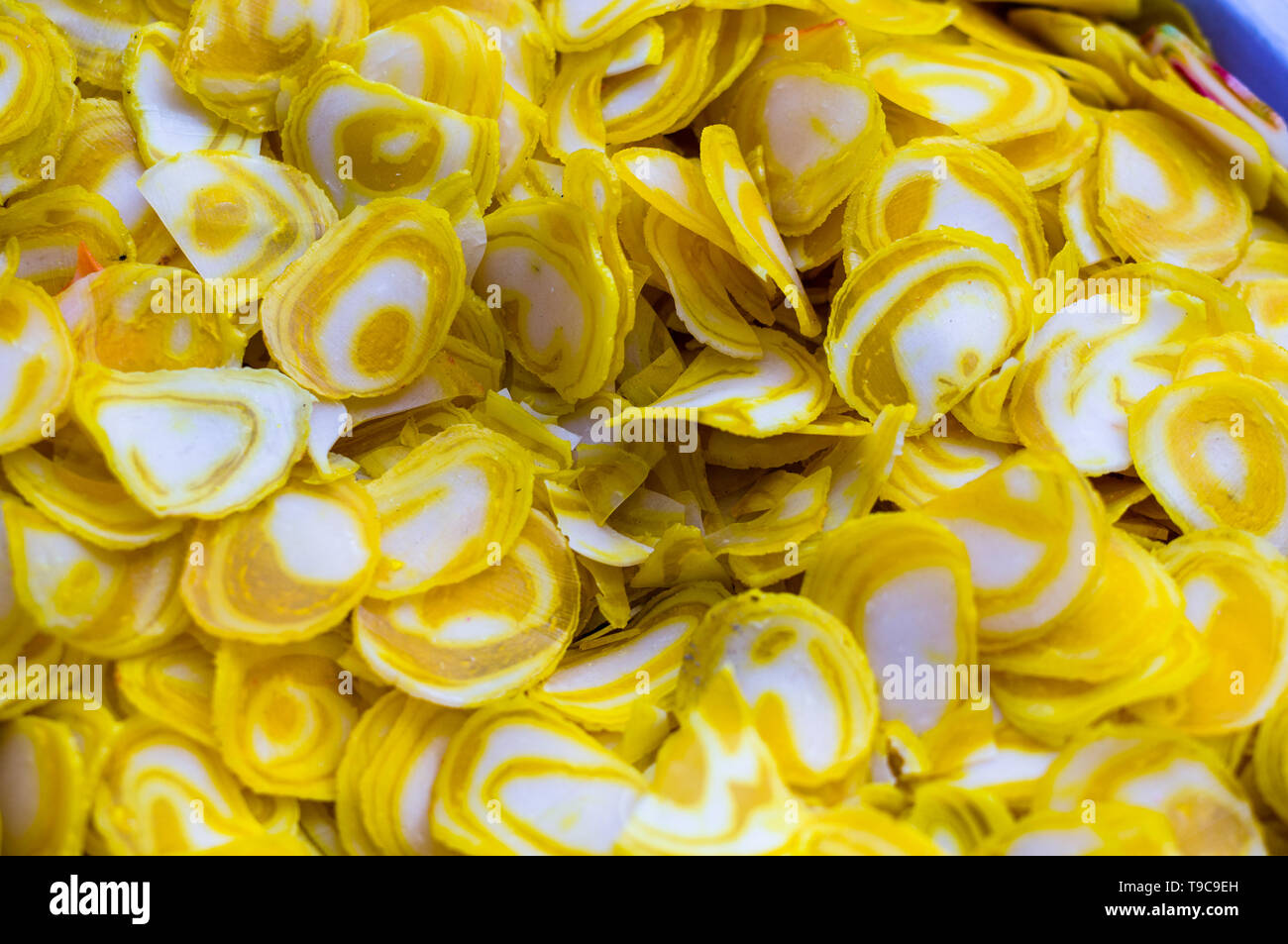 Colorful variety of fryums ready to fry snacks in an indian market ...