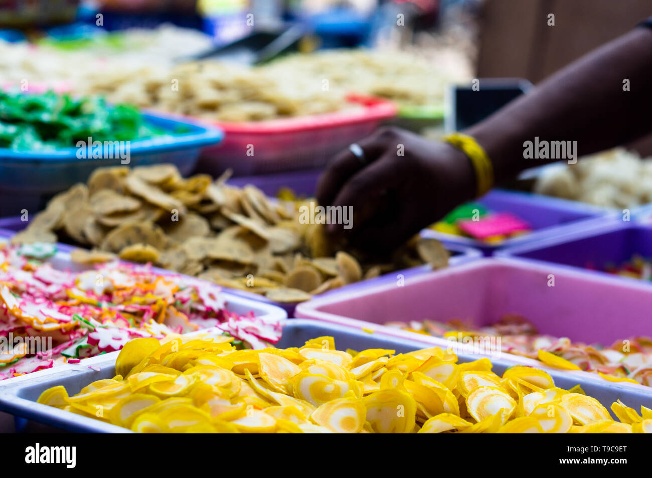 Colorful variety of fryums ready to fry snacks in an indian market ...
