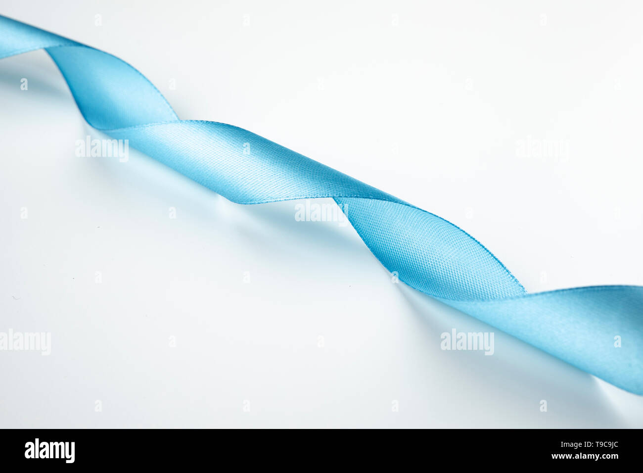 Shiny blue ribbon on white background with copy space Stock Photo - Alamy
