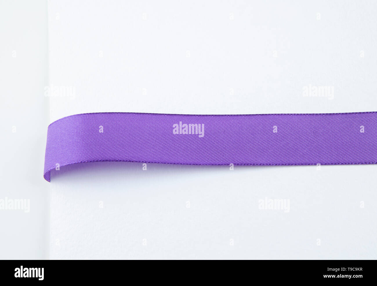Shiny violet ribbon on white background with copy space Stock Photo - Alamy