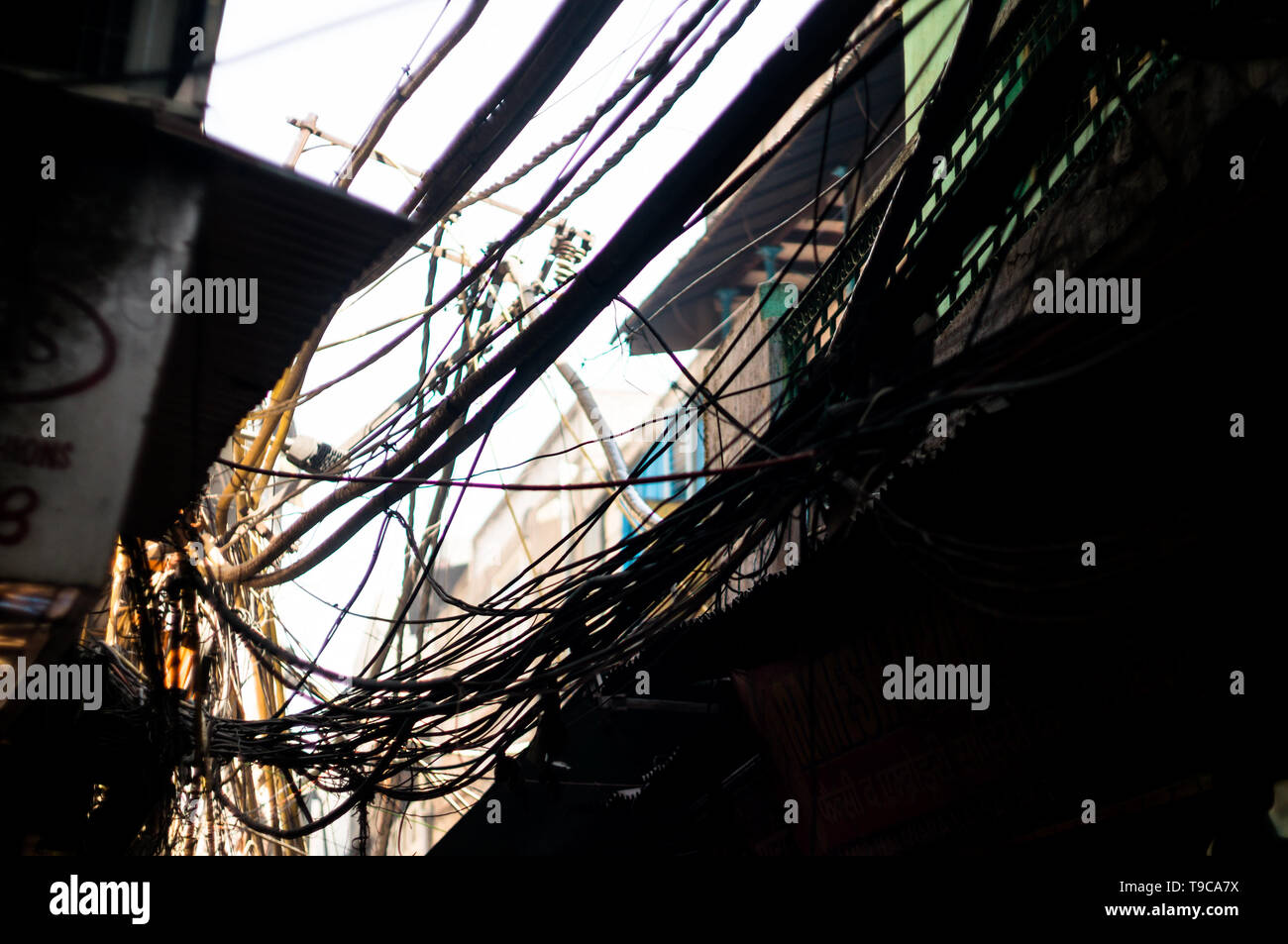Tangled messy electrical wires on pole posing a safety hazard Stock ...