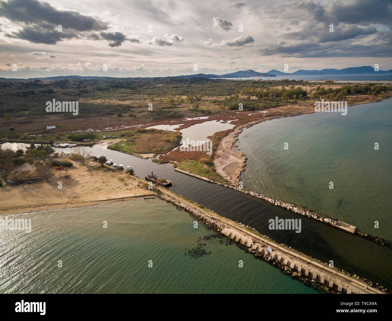 Aerial drone shot of a river ending in the sea .South Corfu Greece ...