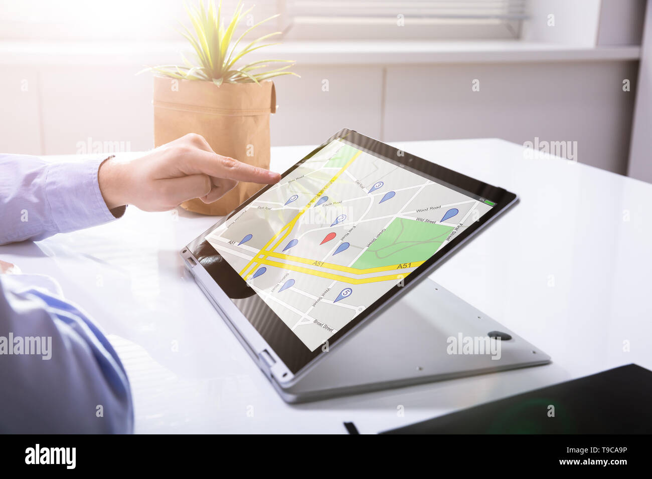 Close-up Of A Person's Hand Using GPS Service On Digital Laptop Stock ...