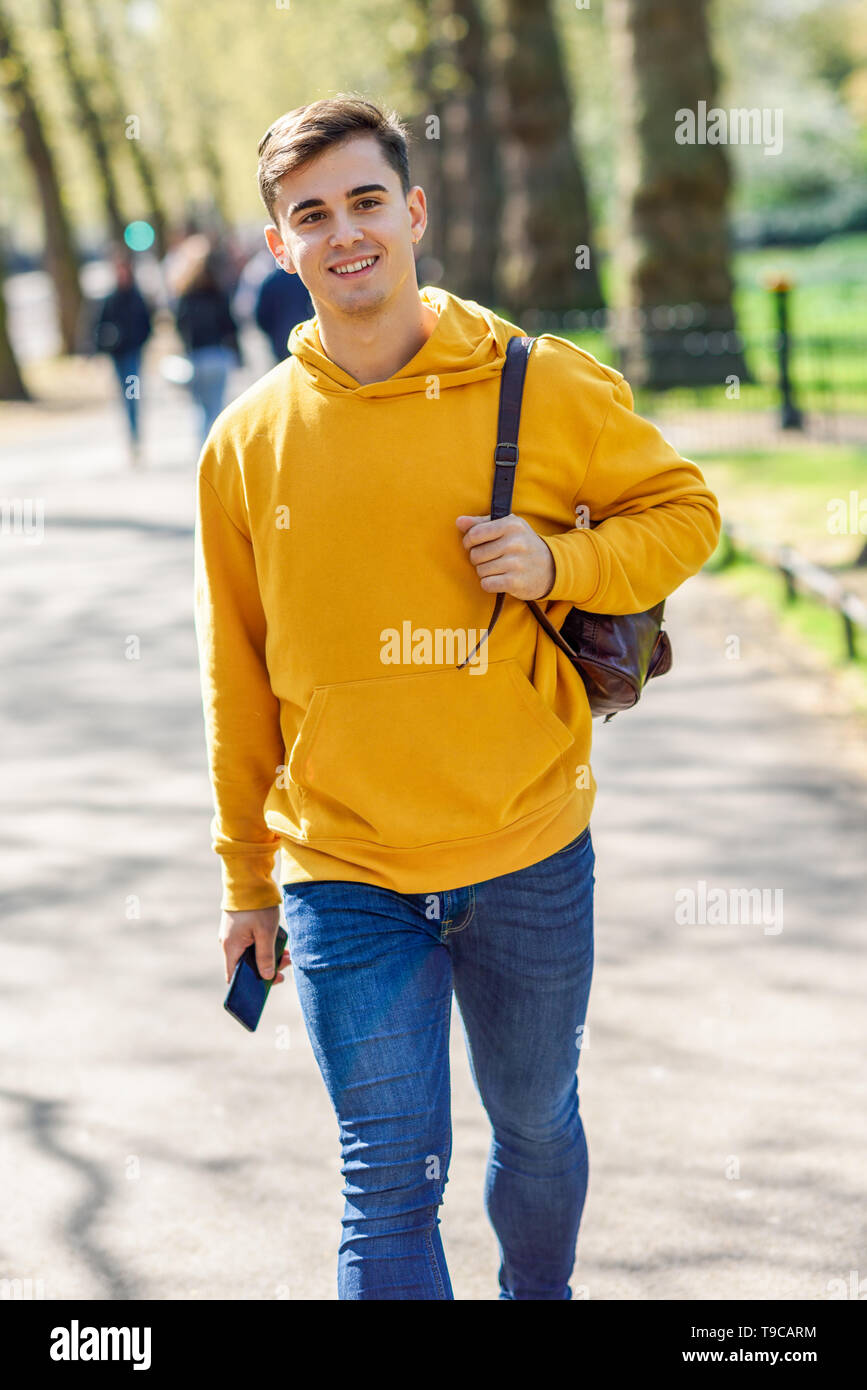 Cool young man walking city hi-res stock photography and images - Alamy