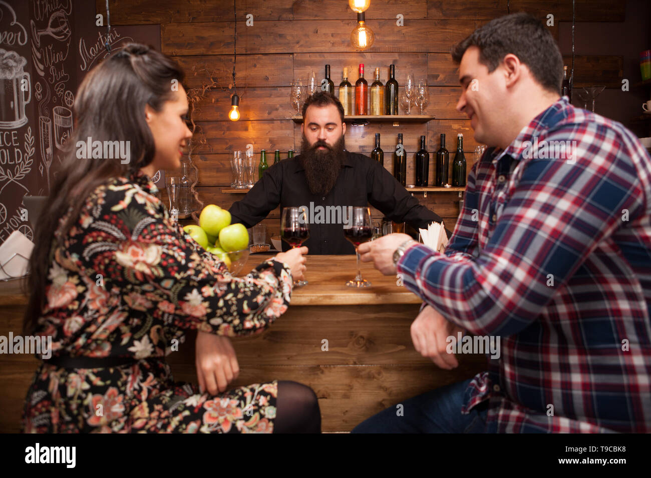 Bartender talking to customers hi-res stock photography and images - Alamy
