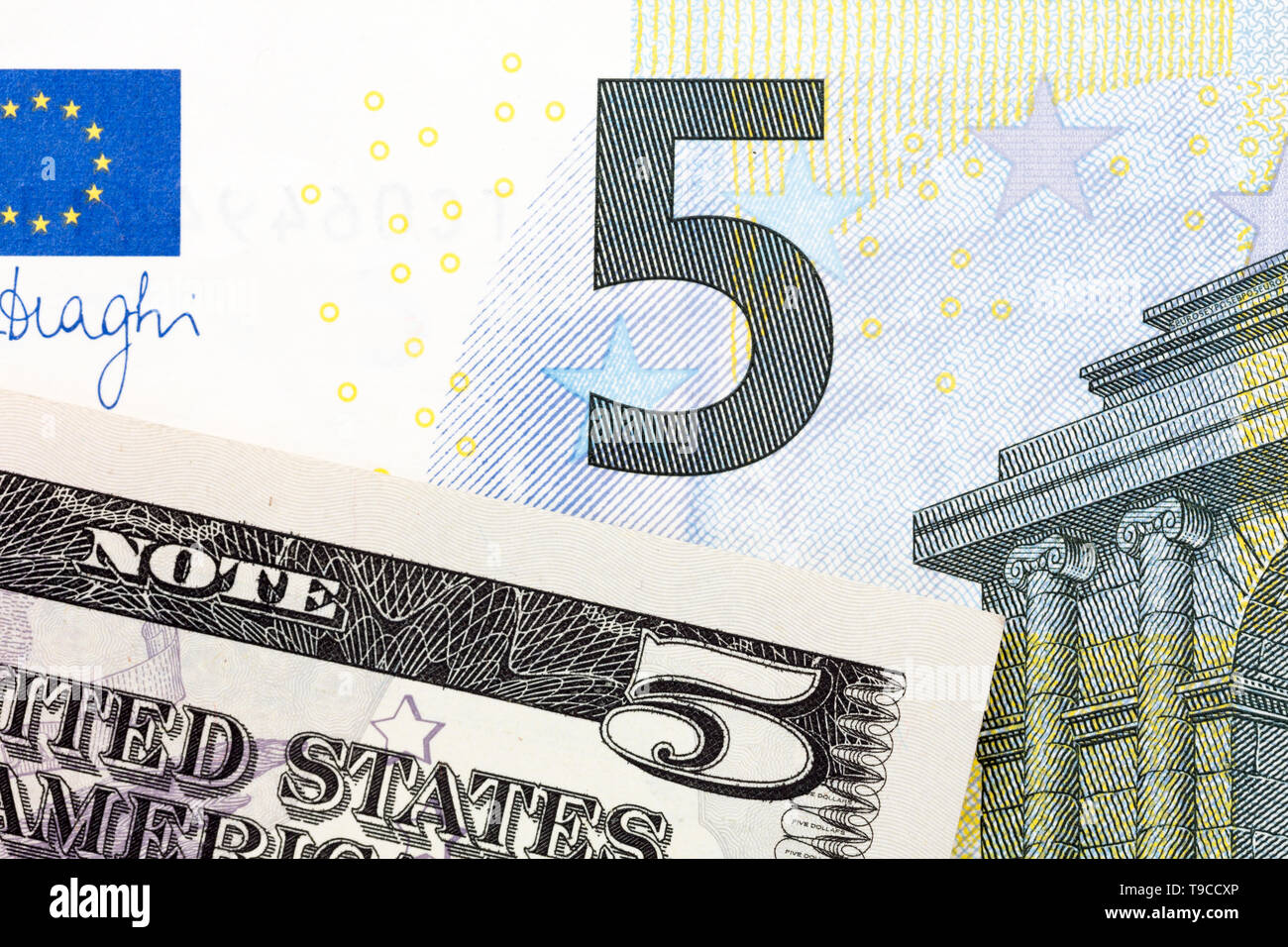 Five euro and dollar banknote close up Stock Photo - Alamy