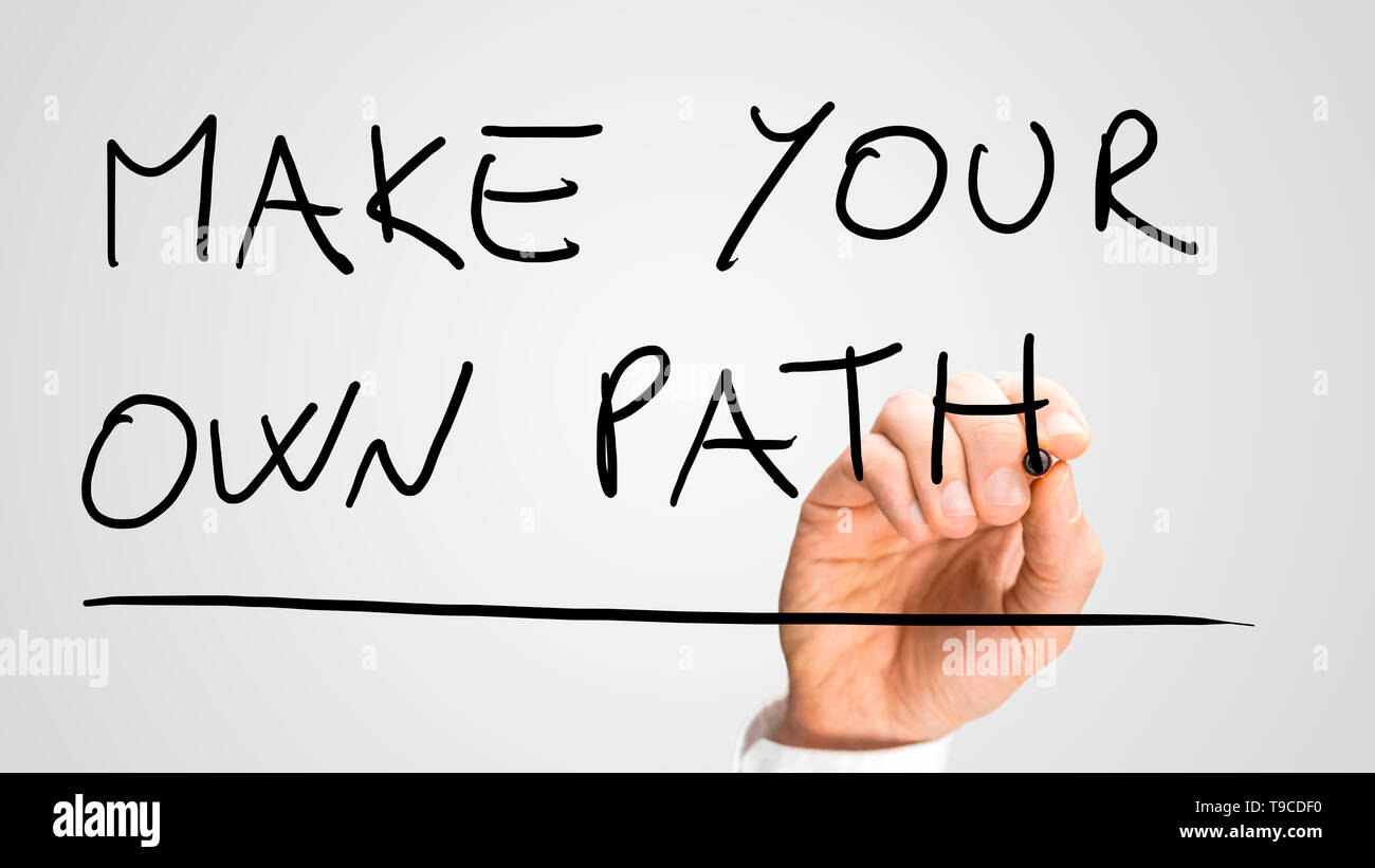 Male hand writing Make your own path on virtual screen. Concept of ...