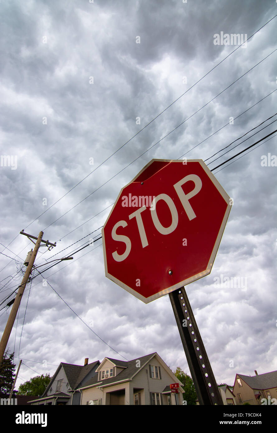 Stop sign with dramatic storm clouds in the background Stock Photo - Alamy