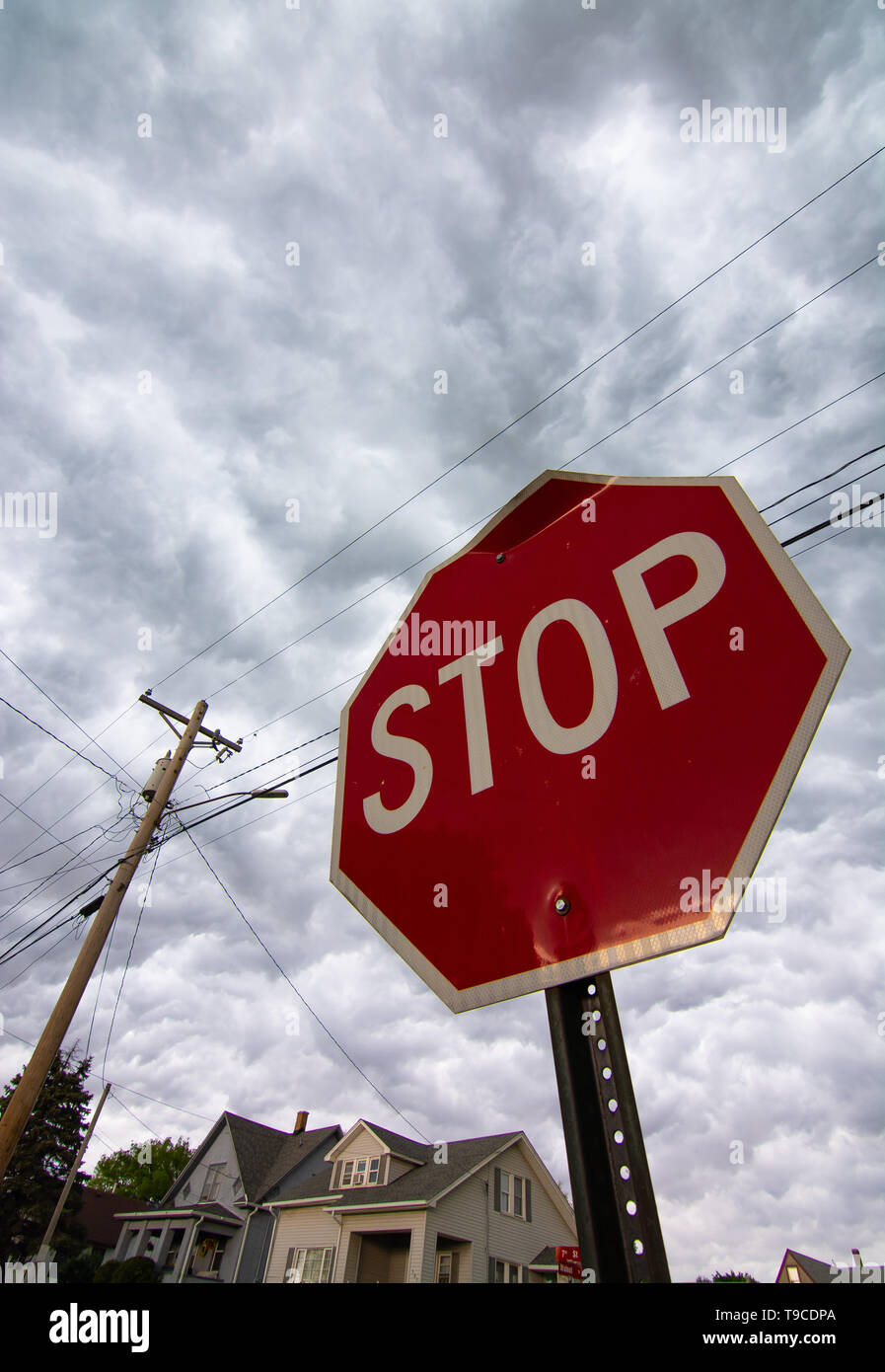 Stop sign with dramatic storm clouds in the background Stock Photo - Alamy