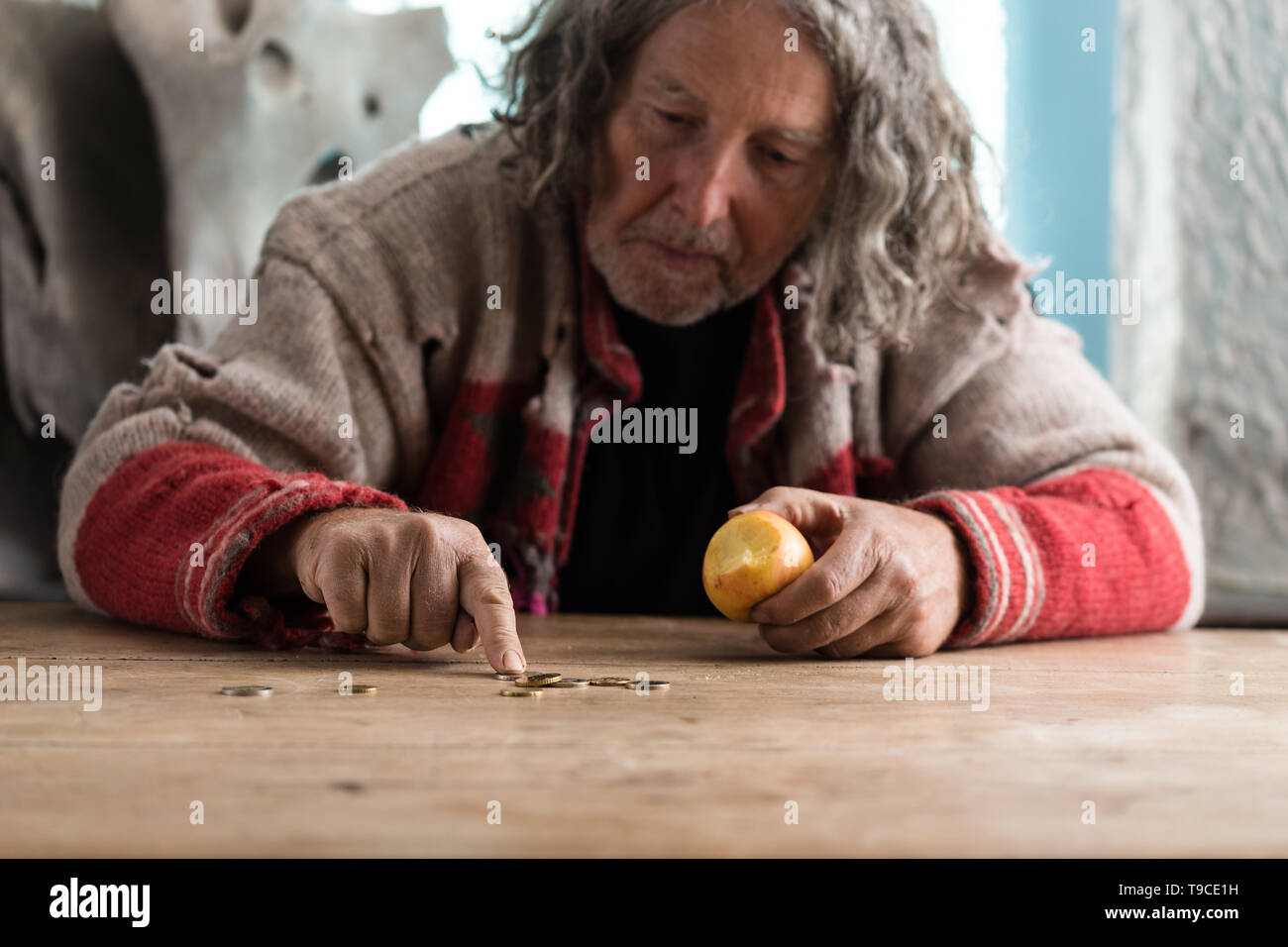 Homeless man counting money hi-res stock photography and images - Alamy