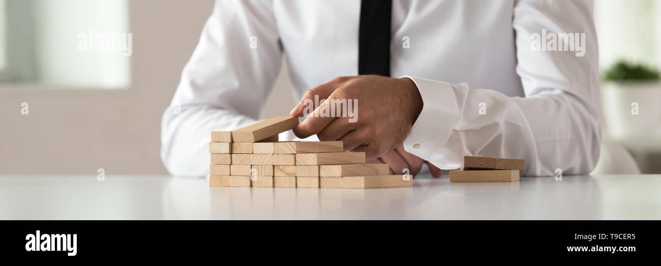 Wide view image of business executive sitting at his office desk ...