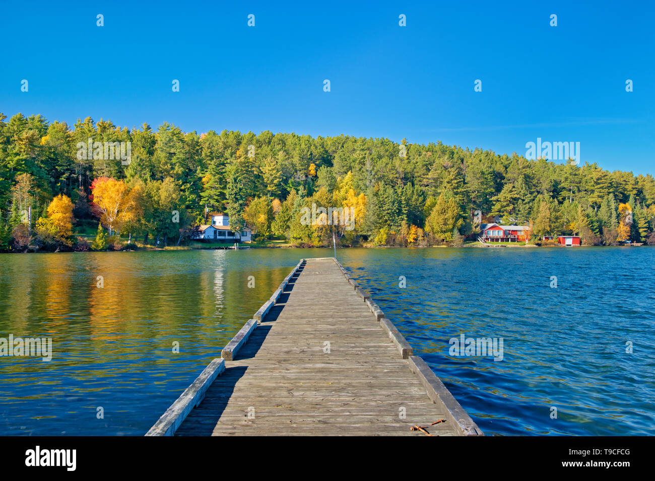 Dock and cottages and Autumn on Crow Lake (also known as Kakagi Lake ...