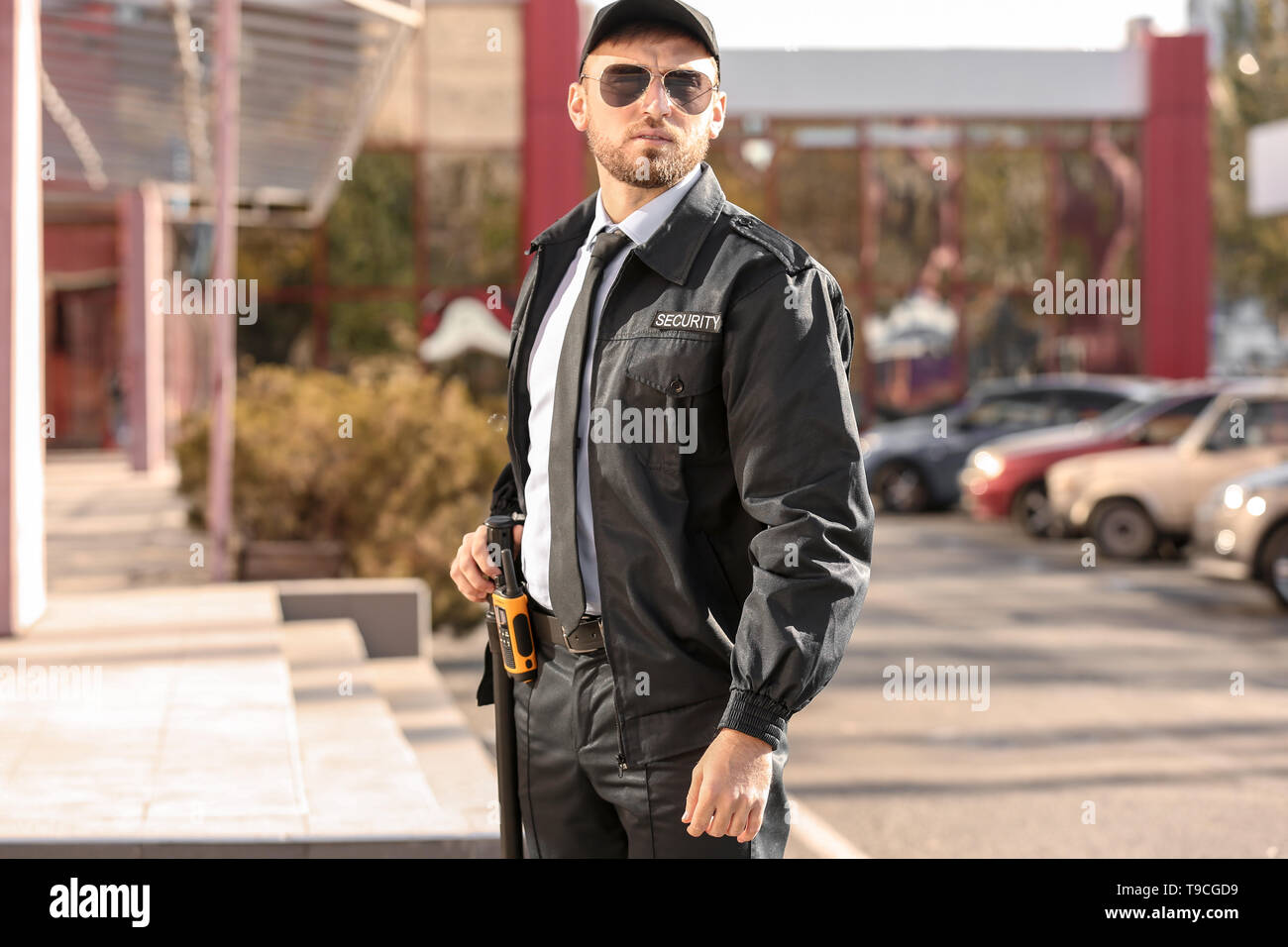 Male security guard outdoors Stock Photo - Alamy