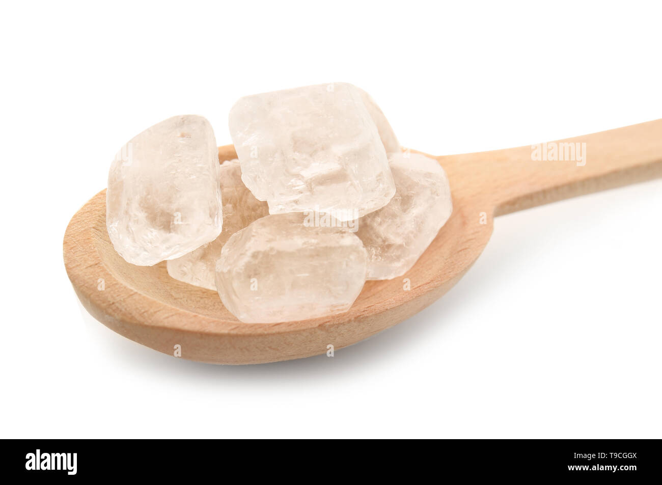 Wooden spoon with sugar on white background Stock Photo - Alamy