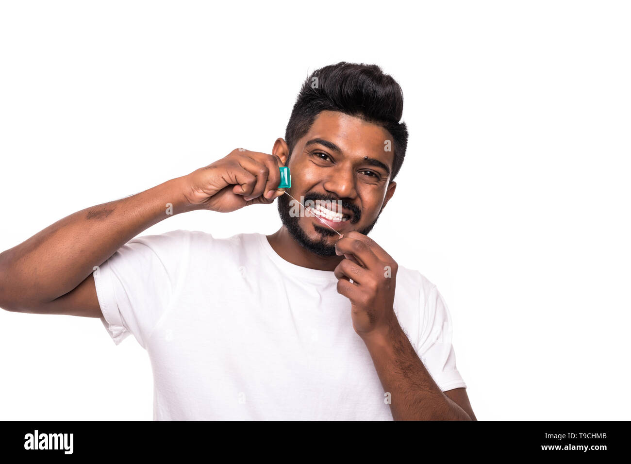 Man flossing his teeth isolated on white background Stock Photo - Alamy