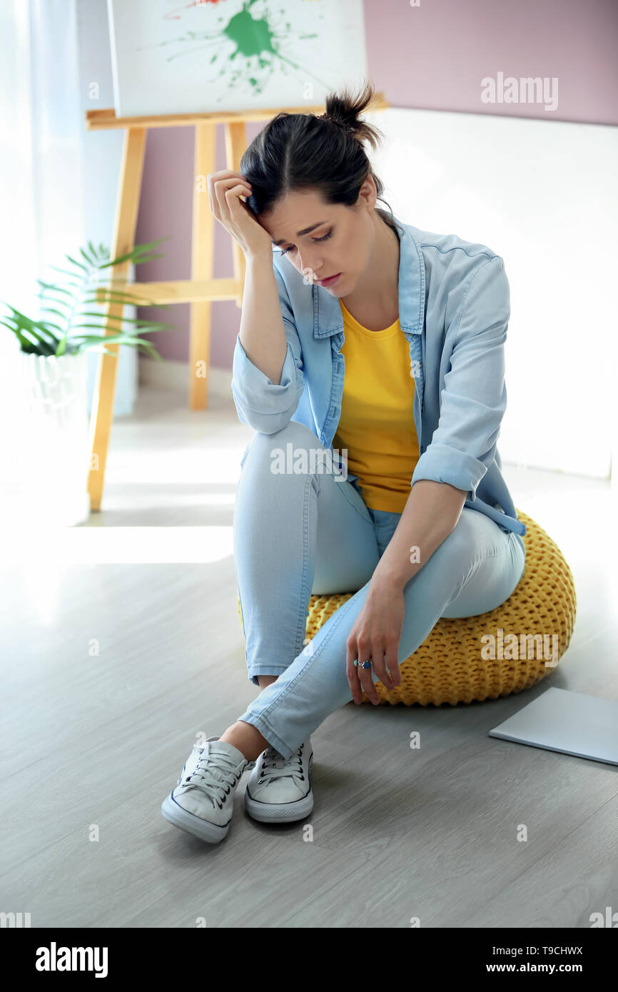 Stressed female painter in studio Stock Photo - Alamy