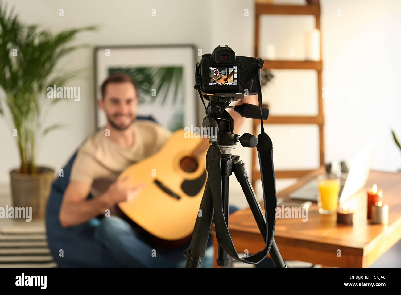 Happy man recording song hi-res stock photography and images - Alamy
