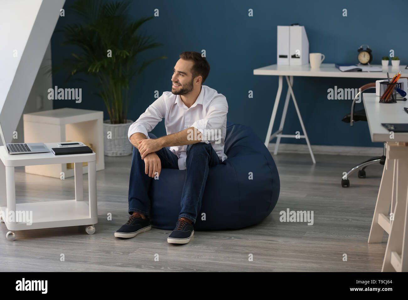 Sitting in bean chair hi-res stock photography and images - Alamy
