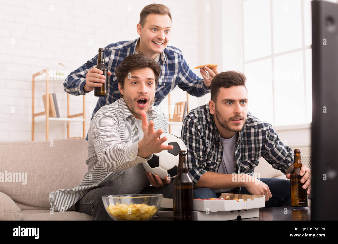 Angry people watching tv hi-res stock photography and images - Alamy