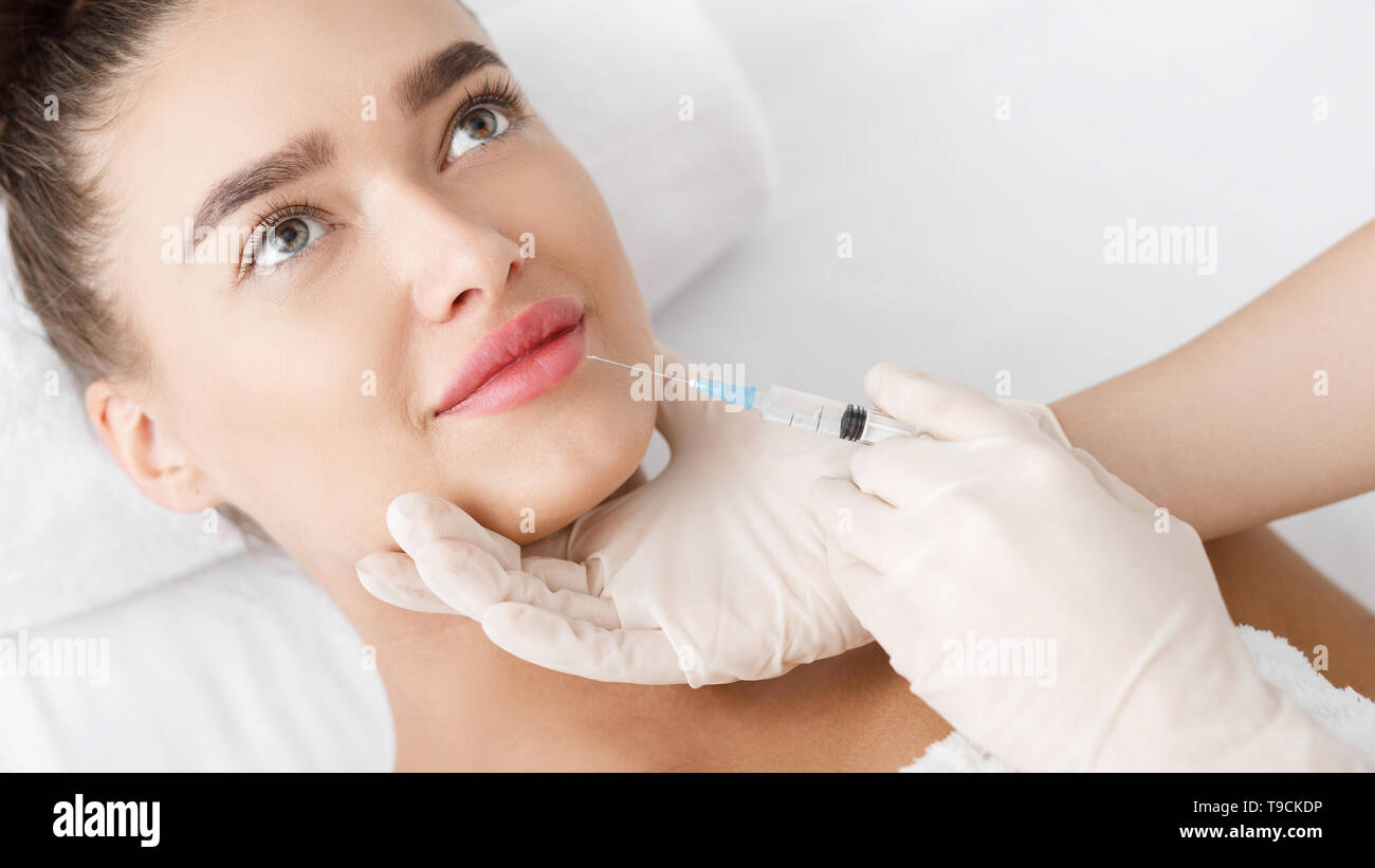 Cosmetologist young woman patient in hi-res stock photography and ...