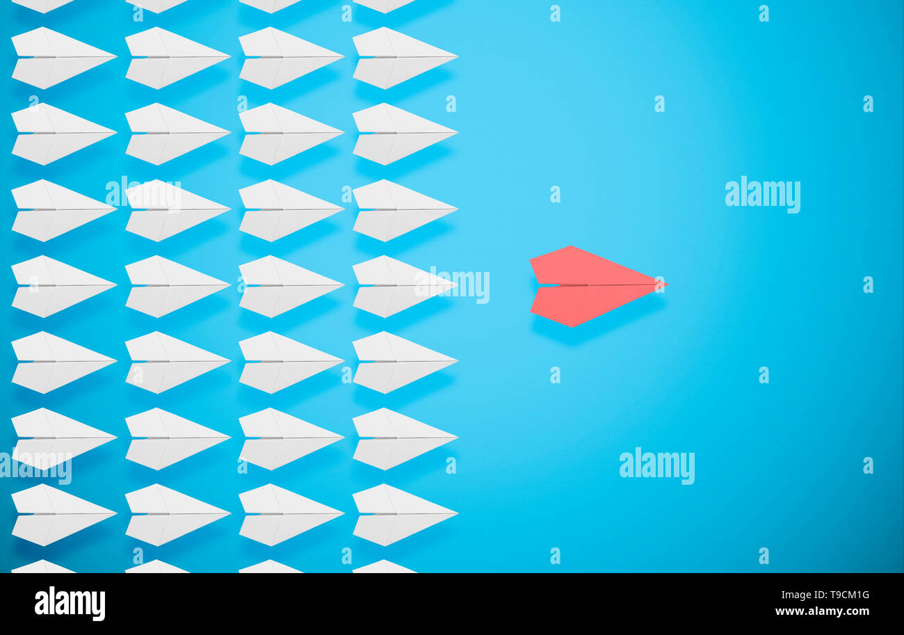 red paper airplane is leading the way to white paper airplanes Stock ...