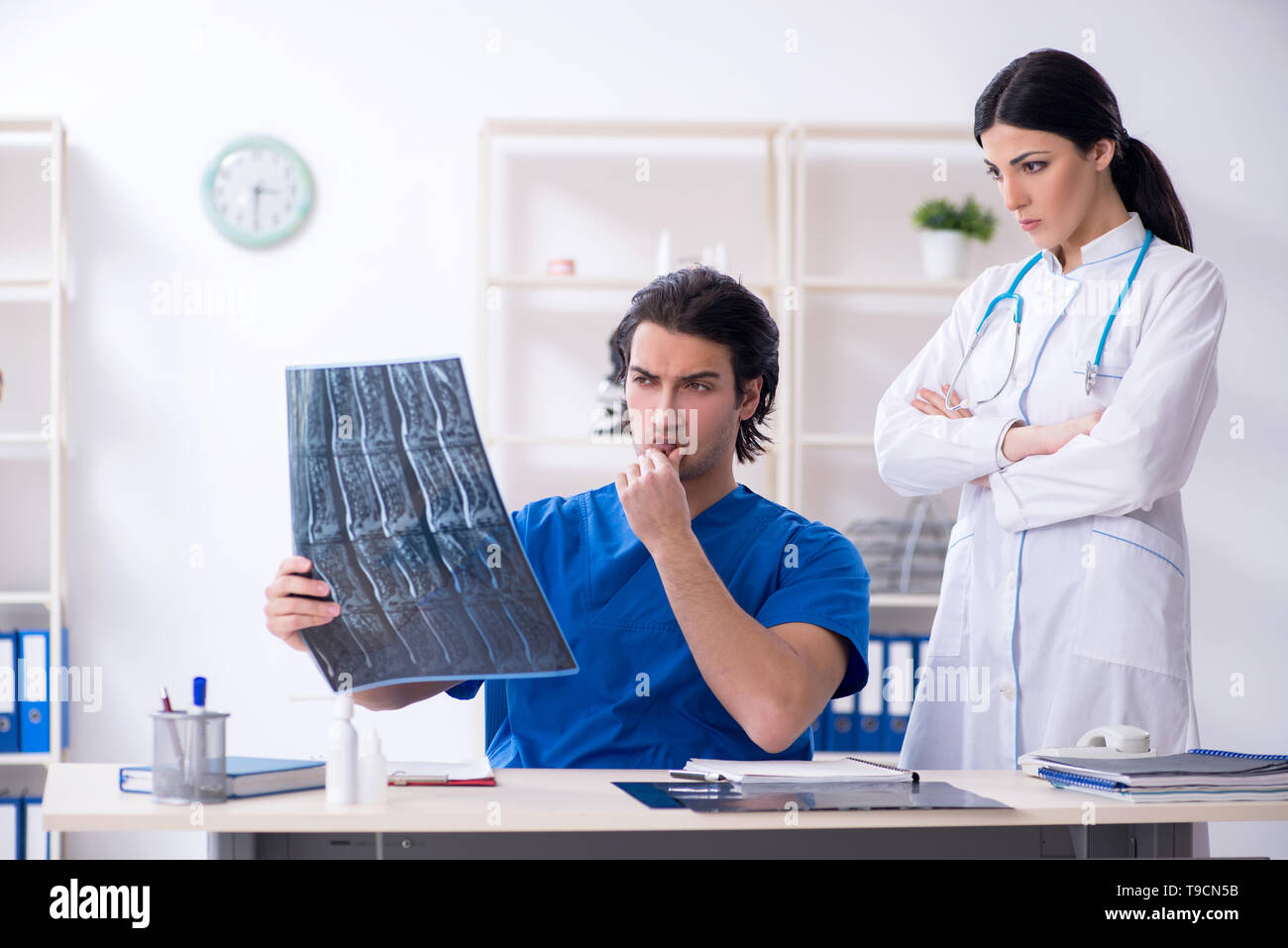 Two young doctors working in the clinic Stock Photo - Alamy