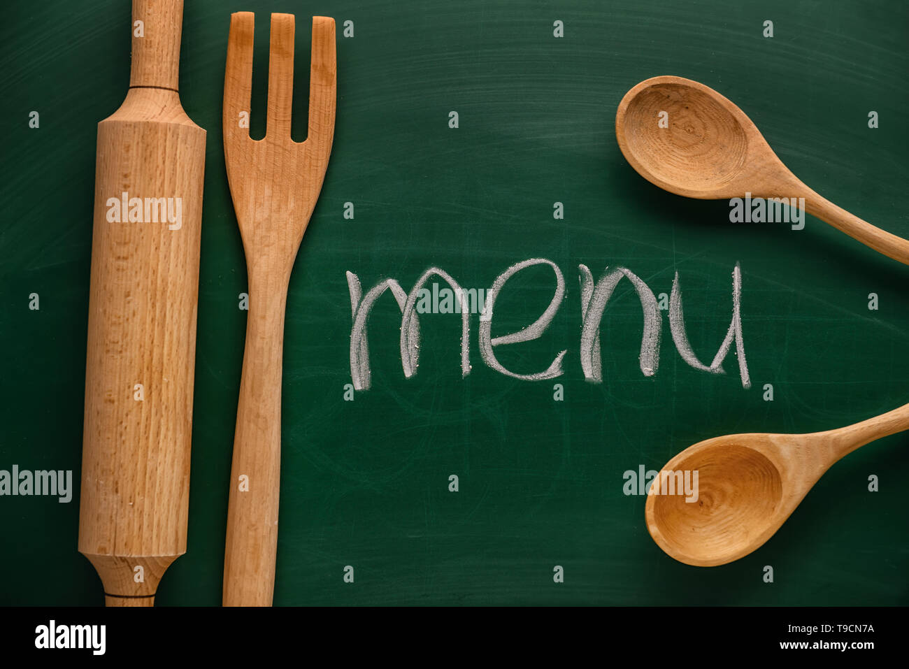 Kitchen utensils and text MENU written on chalkboard, top view Stock ...