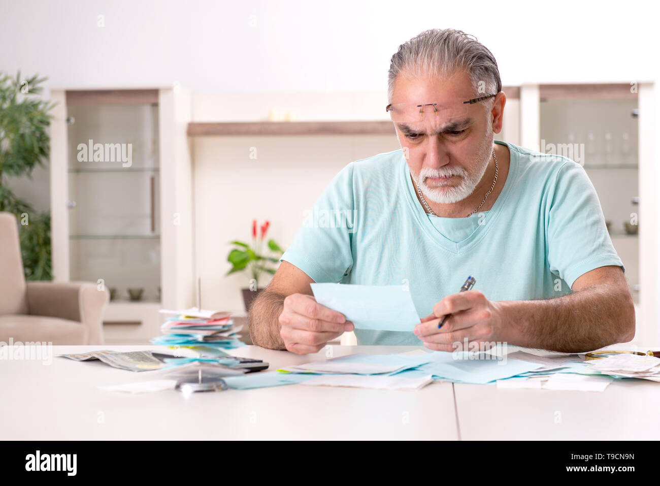 Planning family budget bearded senior hi-res stock photography and ...