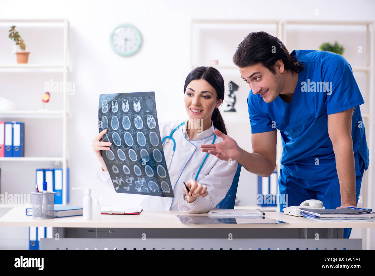 Two young doctors working in the clinic Stock Photo - Alamy