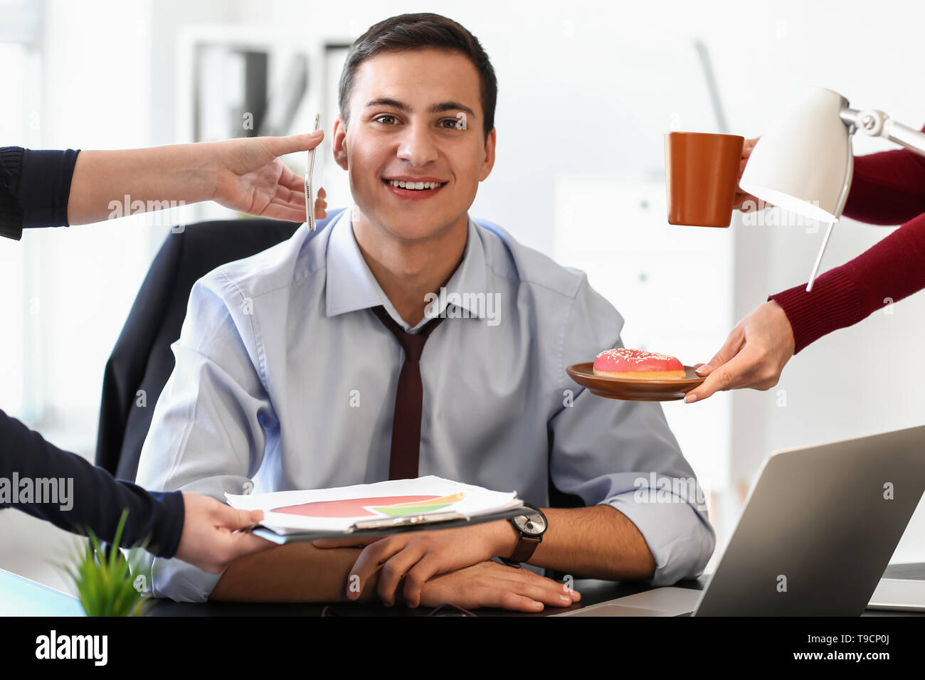Hands of office workers offering their colleague to make choice between ...