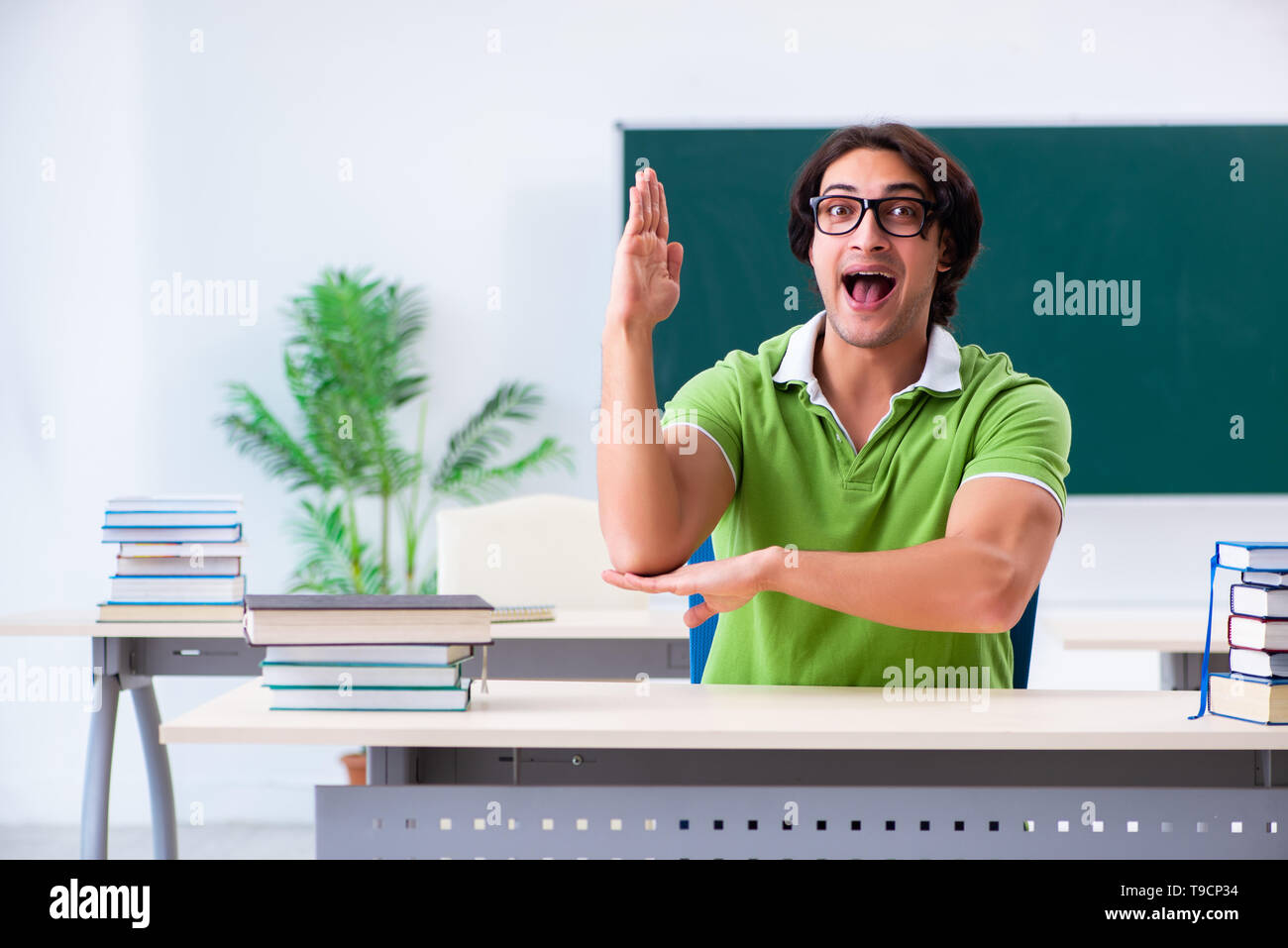Excited young college student waving hi-res stock photography and ...
