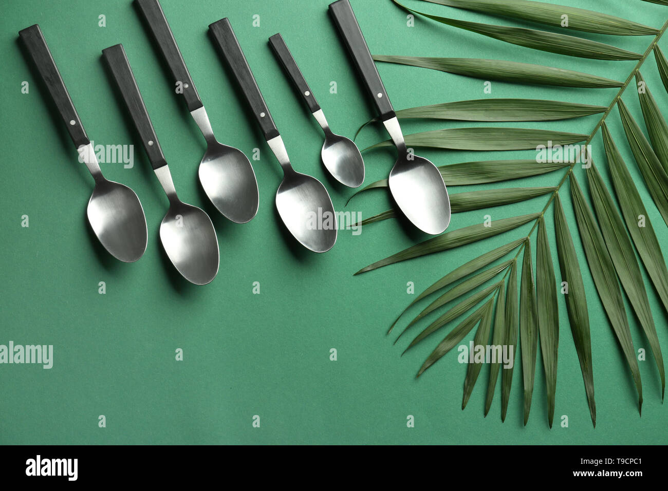 Set of spoons on colour background Stock Photo - Alamy