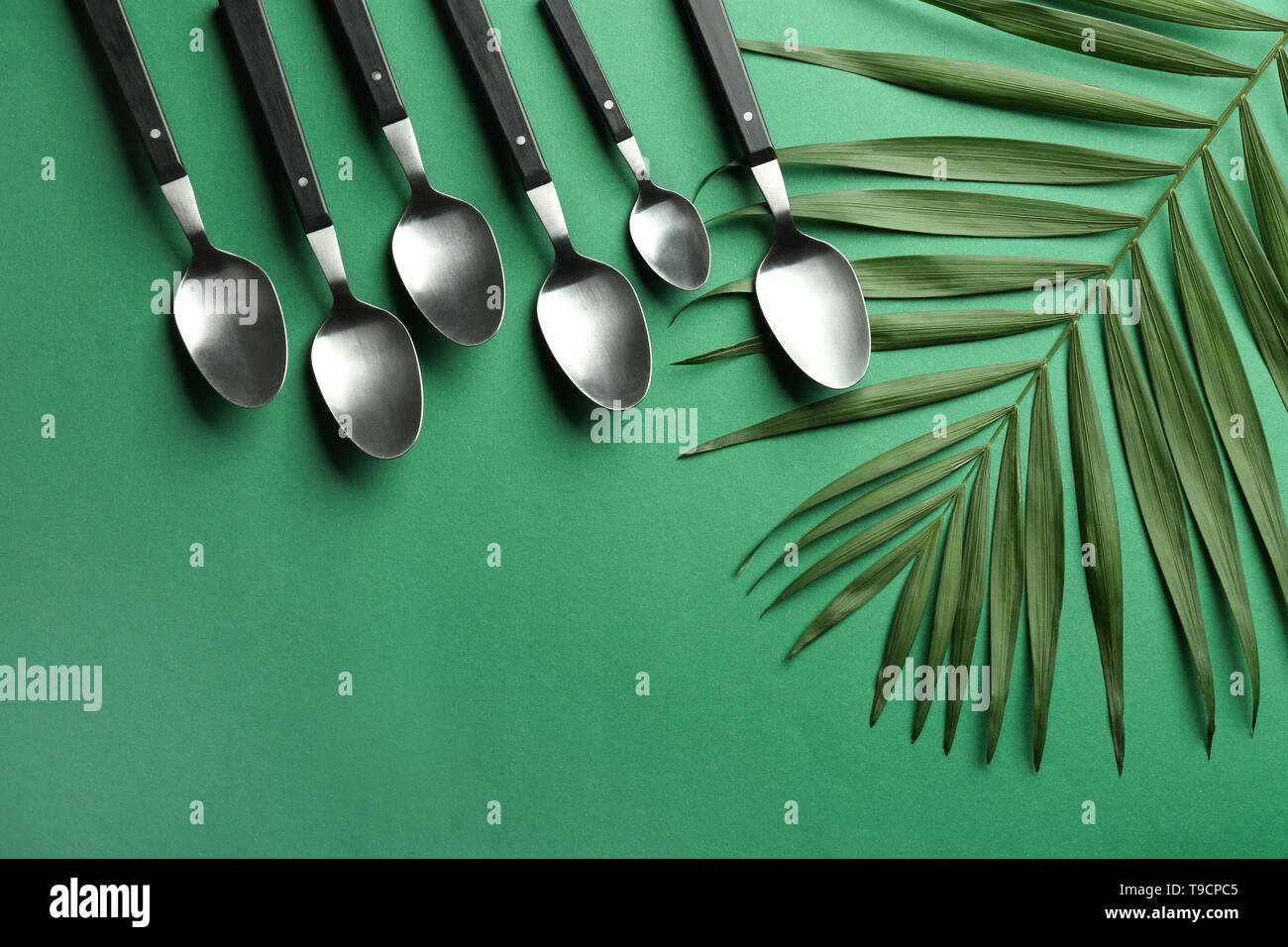 Set of spoons on colour background Stock Photo - Alamy