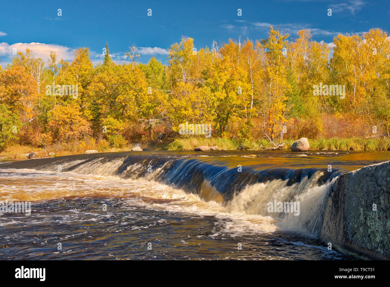 Whiteshell River flows into White Lake at Rainbow Falls in autumn ...