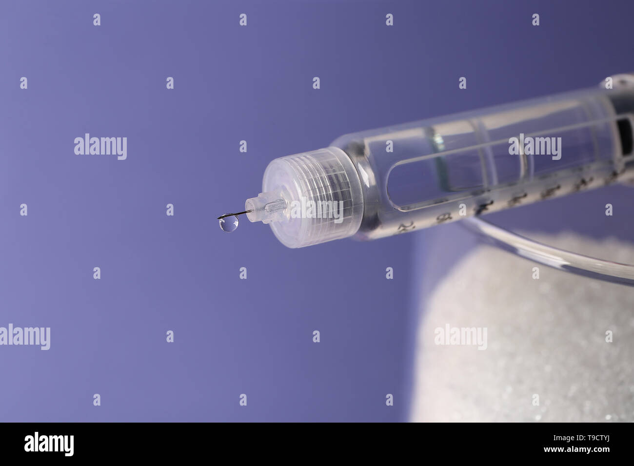 Insulin syringe and glass with sugar on color background, closeup ...
