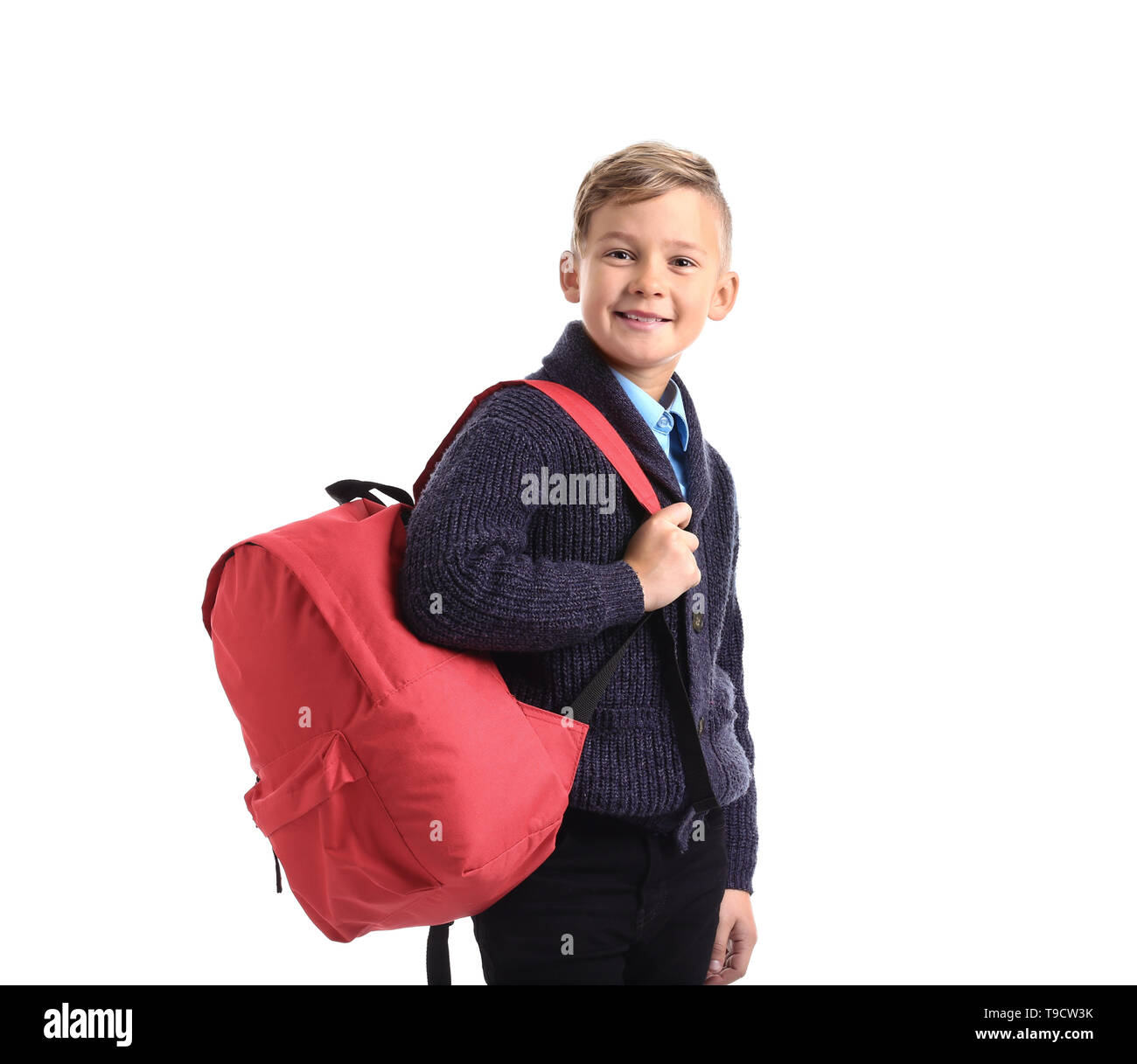Cute little schoolboy with backpack on white background Stock Photo - Alamy